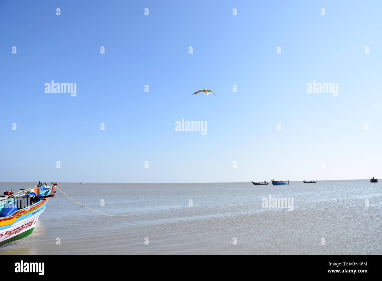 Fishing boats on a calm Sea Stock Photo - Alamy