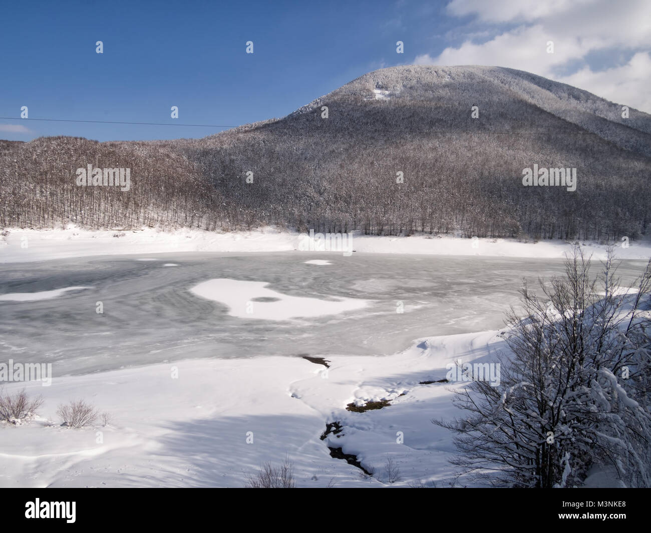 Iced over lake, Apennine mountains.Lagastrello Stock Photo - Alamy