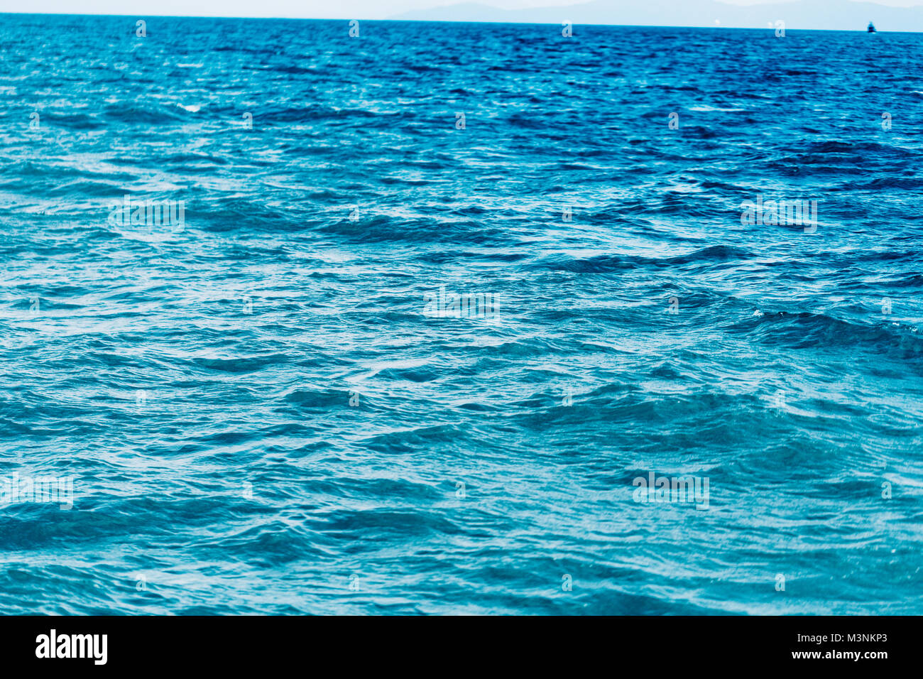 Bright Blue ocean with smooth wave background Stock Photo - Alamy