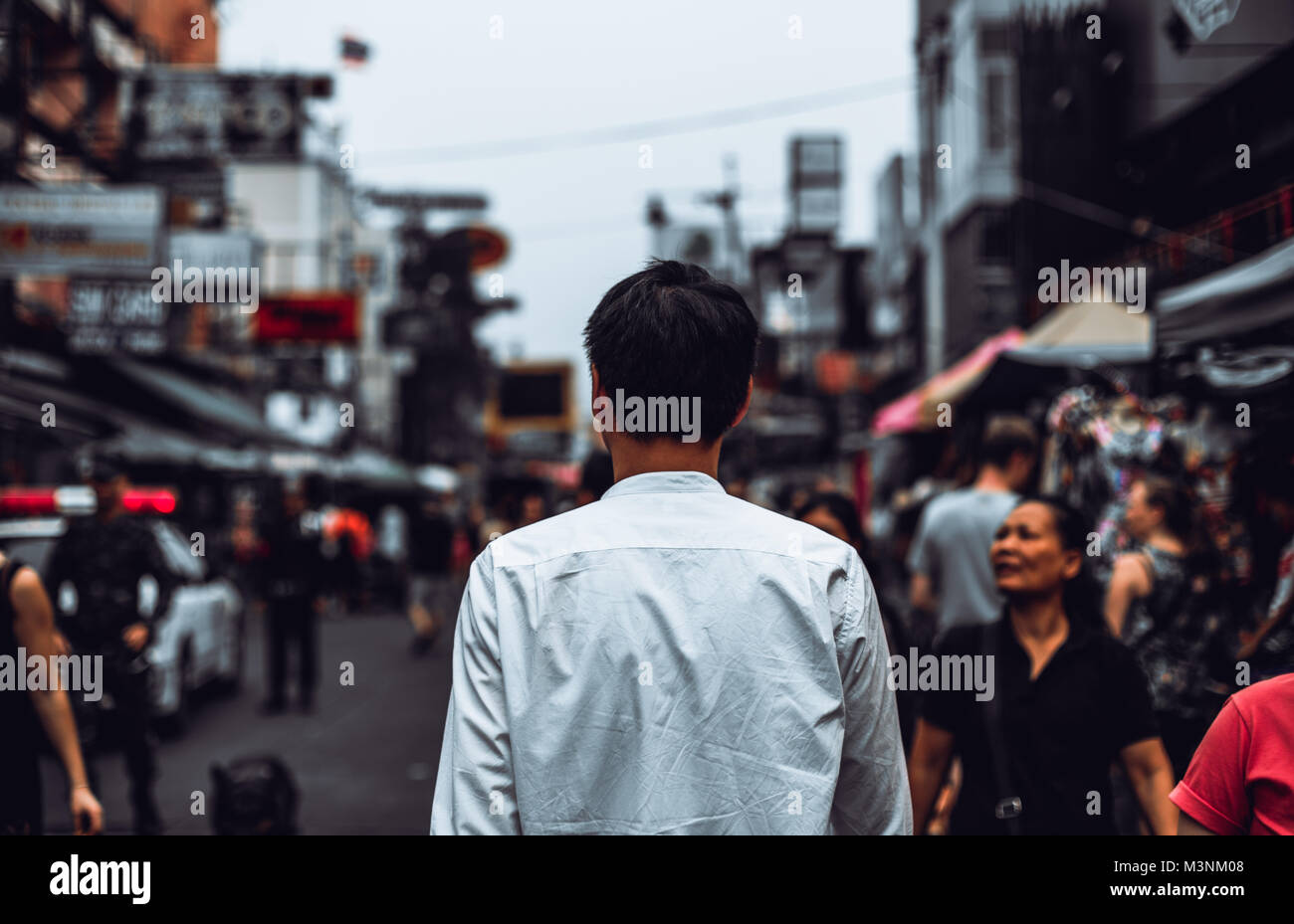 Back view of Portrait Young asian man walking on khaosan road, bangkok ...