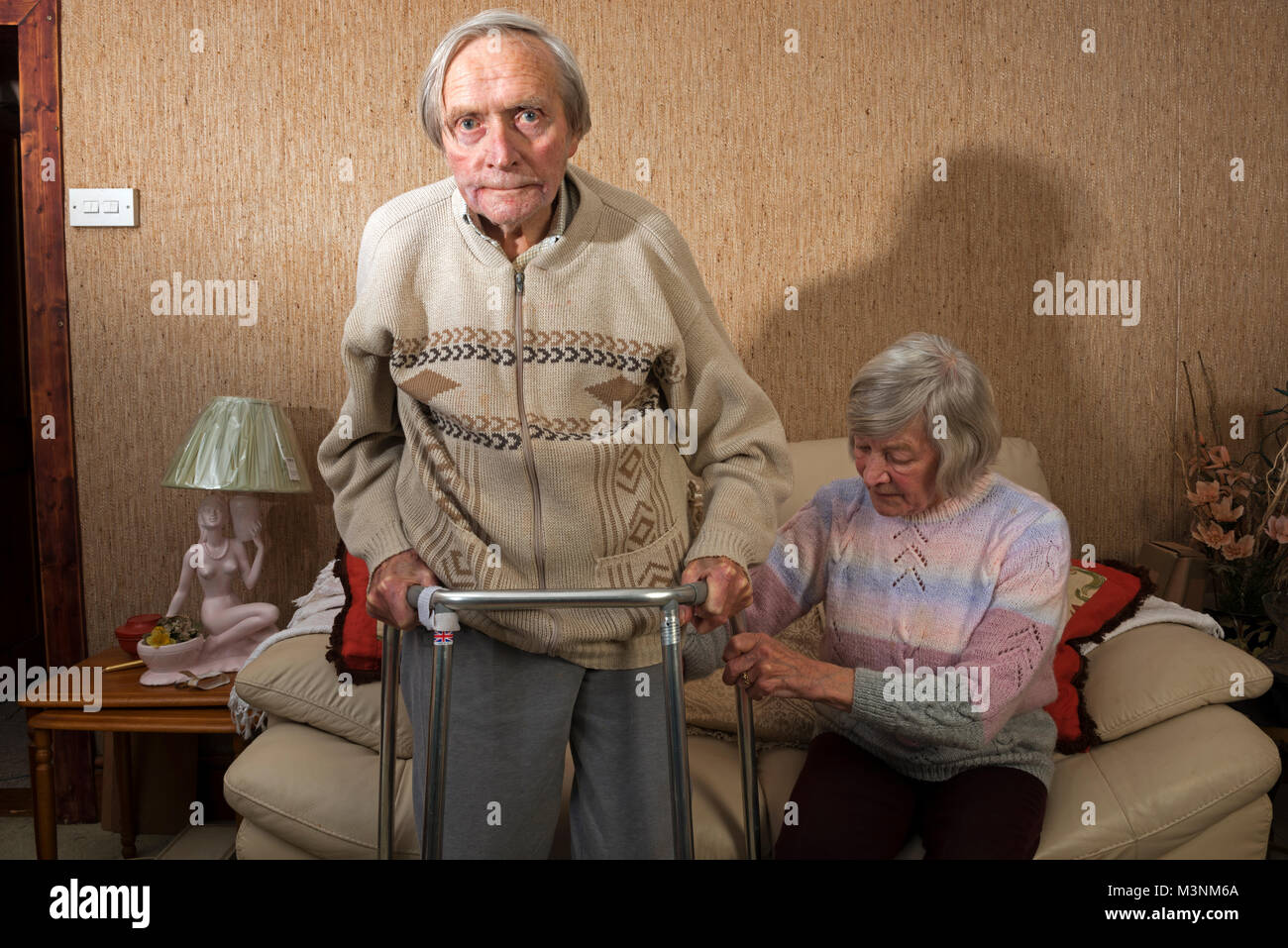 Elderly man learning to walk again after illness Stock Photo - Alamy