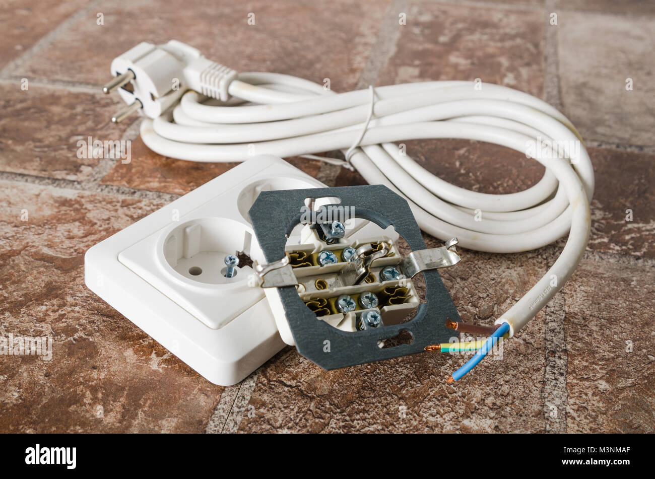 Electric socket and cable, close-up Stock Photo - Alamy