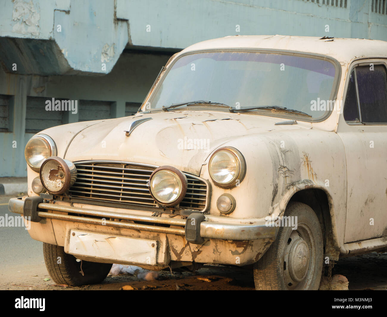 Rusty white car parked on a street of Chennai, India Stock Photo - Alamy