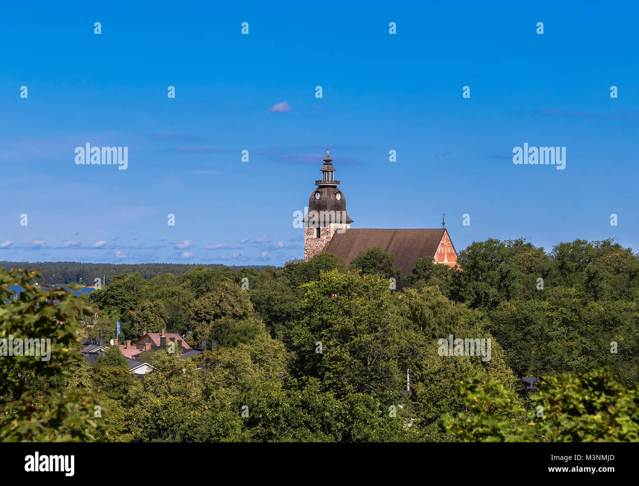 Landscape with Naantali Church towering above the trees Stock Photo - Alamy