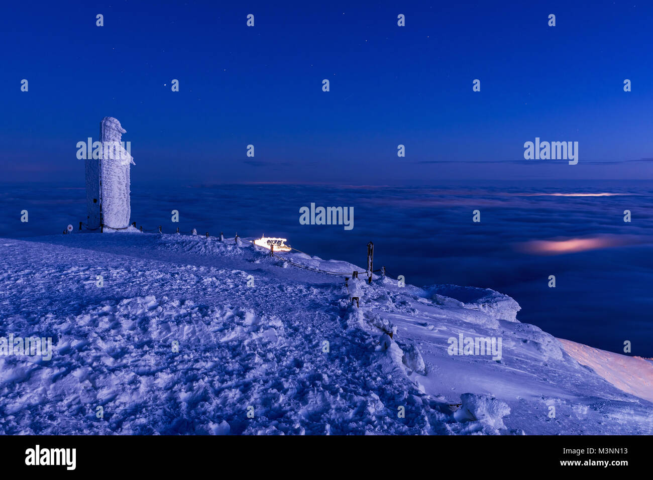 View of the valley from the summit of Snezka. Inverted clouds in the ...