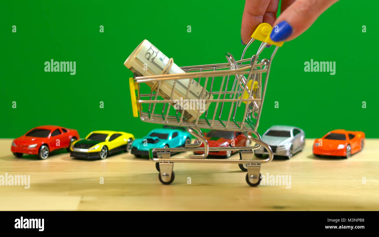 E-commerce retail shopping for cars concept with miniature shopping ...