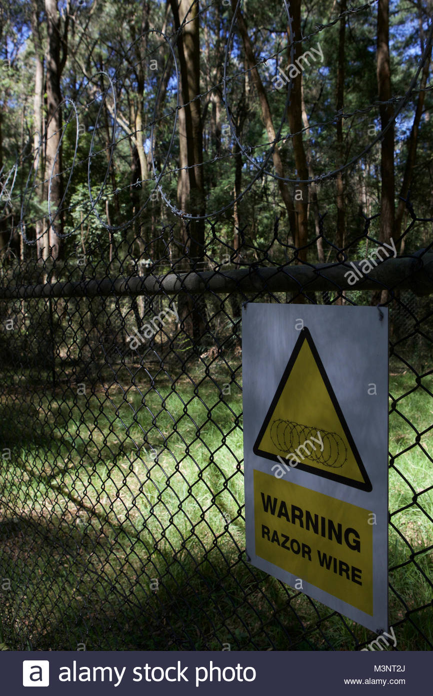 Razor Wire Fence Warning Sign Stock Photos & Razor Wire Fence Warning ...