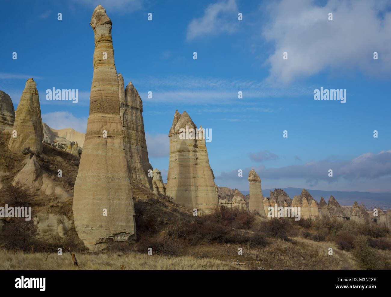 Volcanic rock formations known as Fairy Chimneys in Cappadocia, Turkey ...