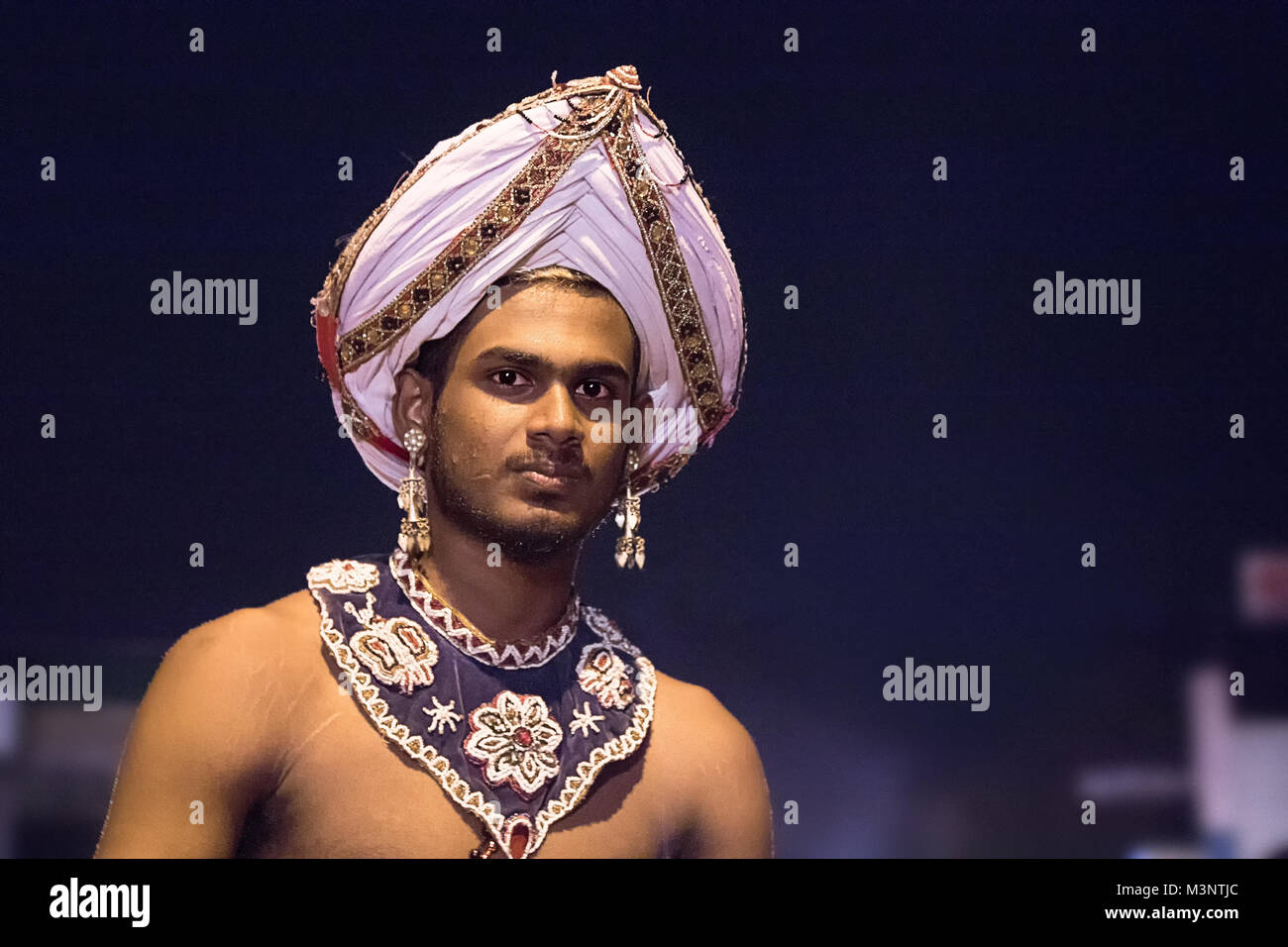 Sri Lanka Kandy Esala Perahera parade performer dancer wearing turban ...