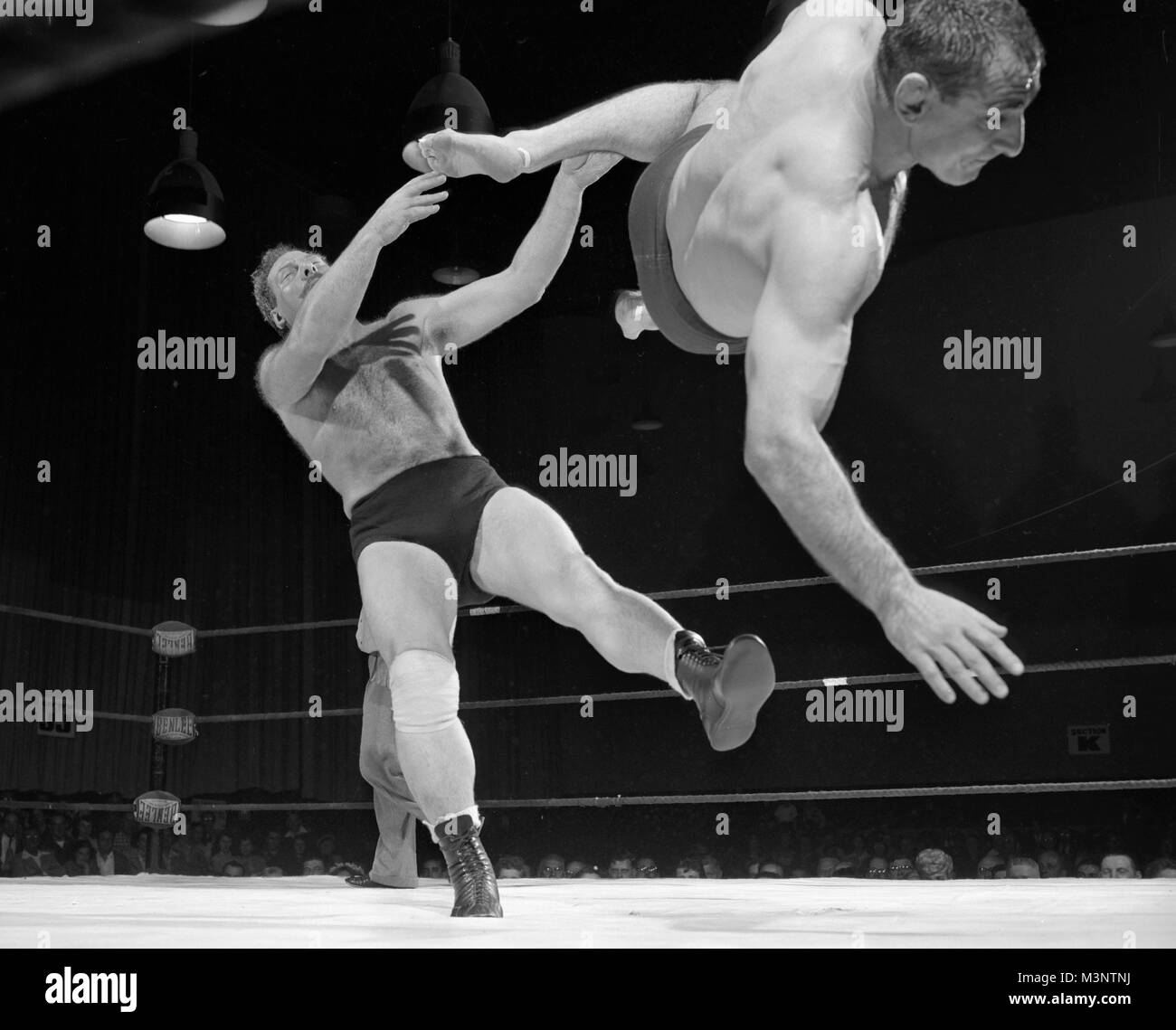 Antonino Rocca, right, drops Aldo Bogni with a flying kick, 1952 Stock ...
