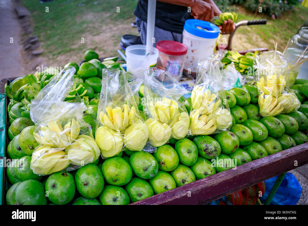 Manila, Philippines - Feb 4, 2018 : A street food vendor slices fresh ...