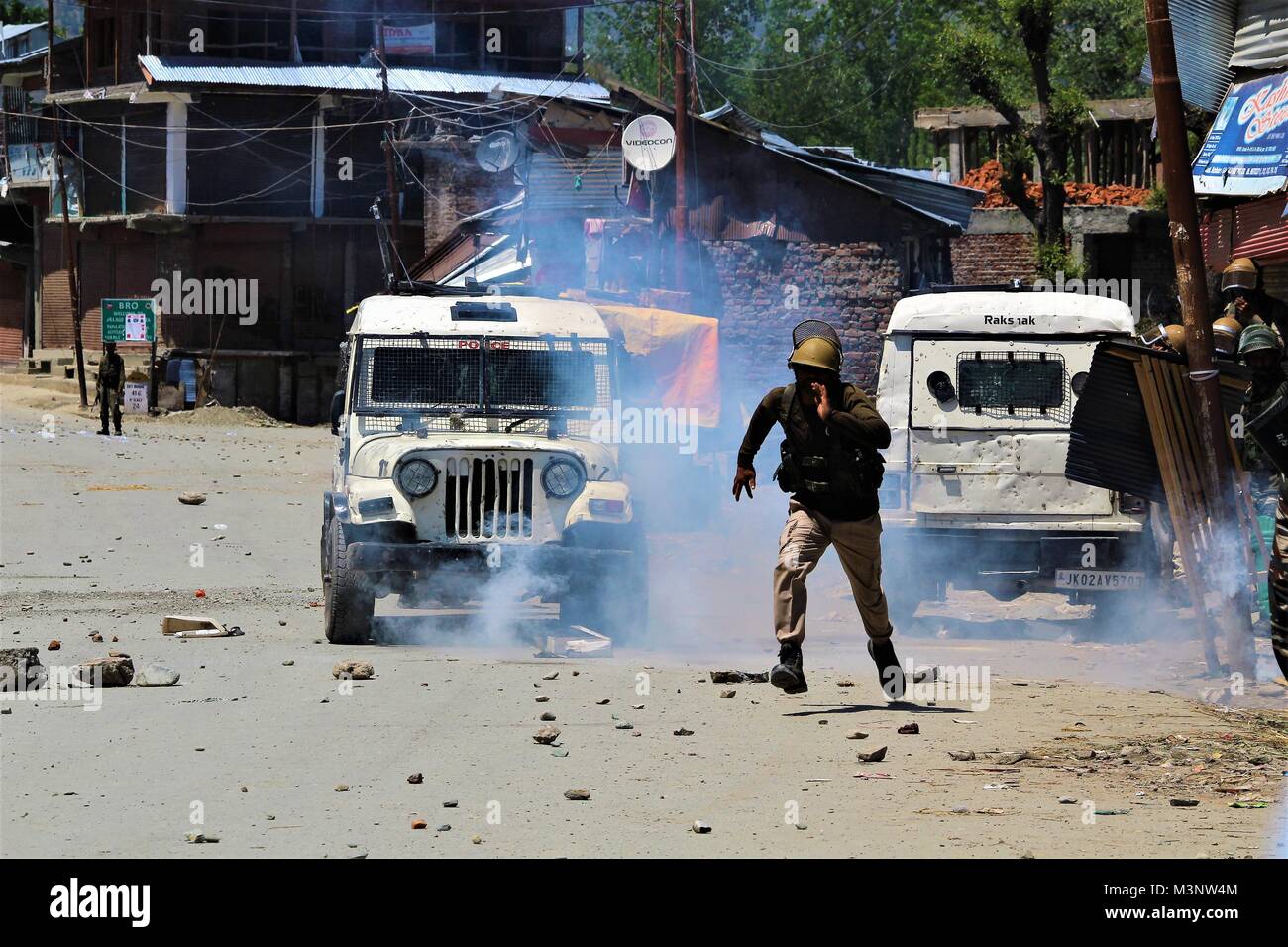 police running in Sopore area, Kashmir, India, Asia Stock Photo - Alamy