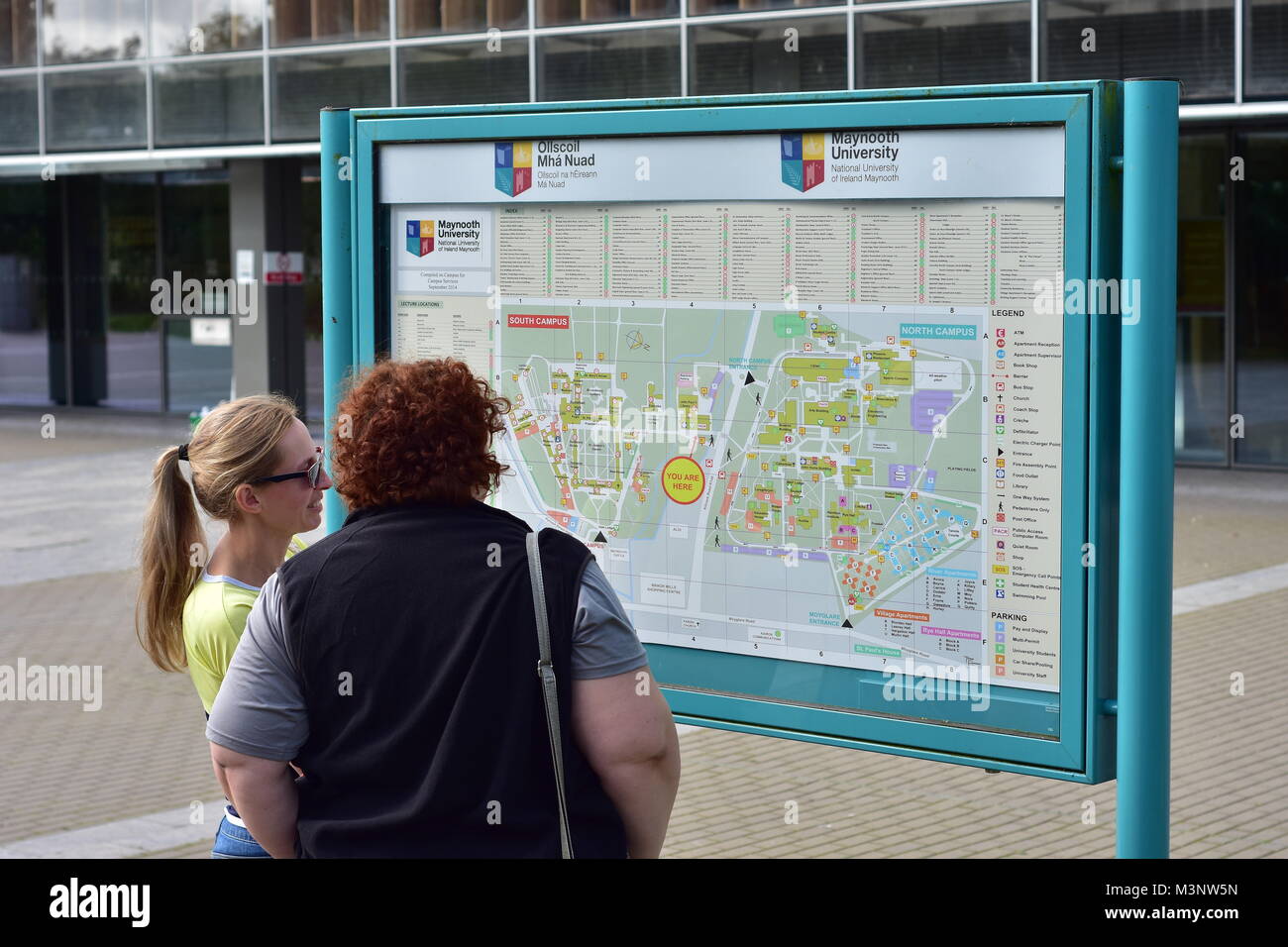 Visitors at campus site map of Maynooth University in town of Maynooth ...