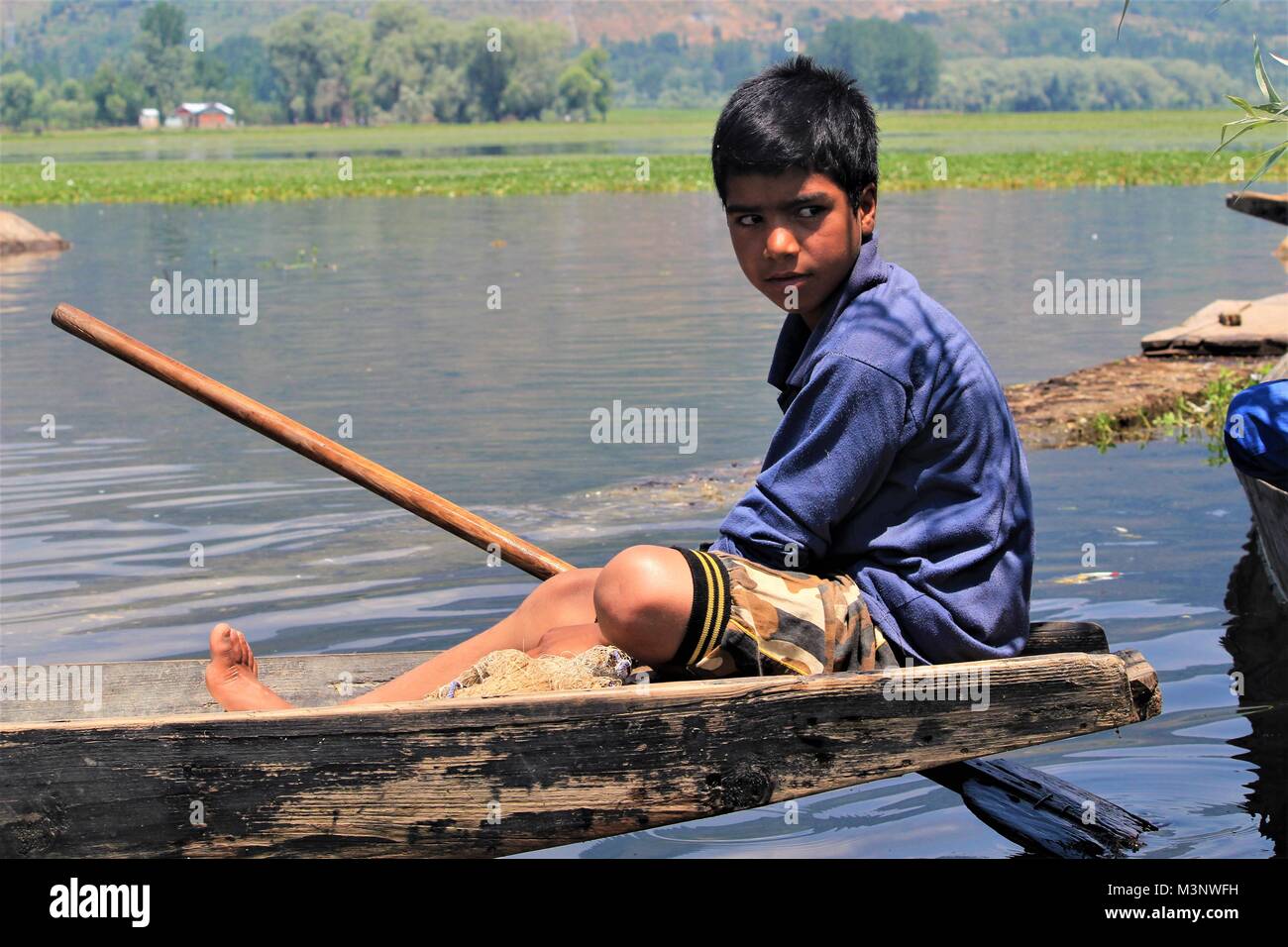 Boy rowing boat hi-res stock photography and images - Alamy