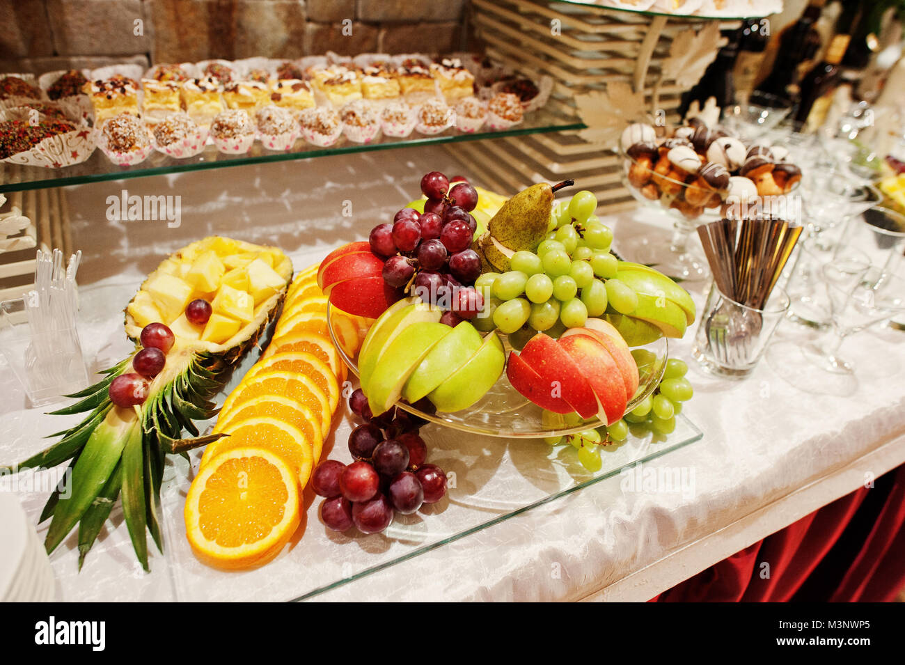 Close-up photo of a huge variety of fruits and sweet desserts on the ...