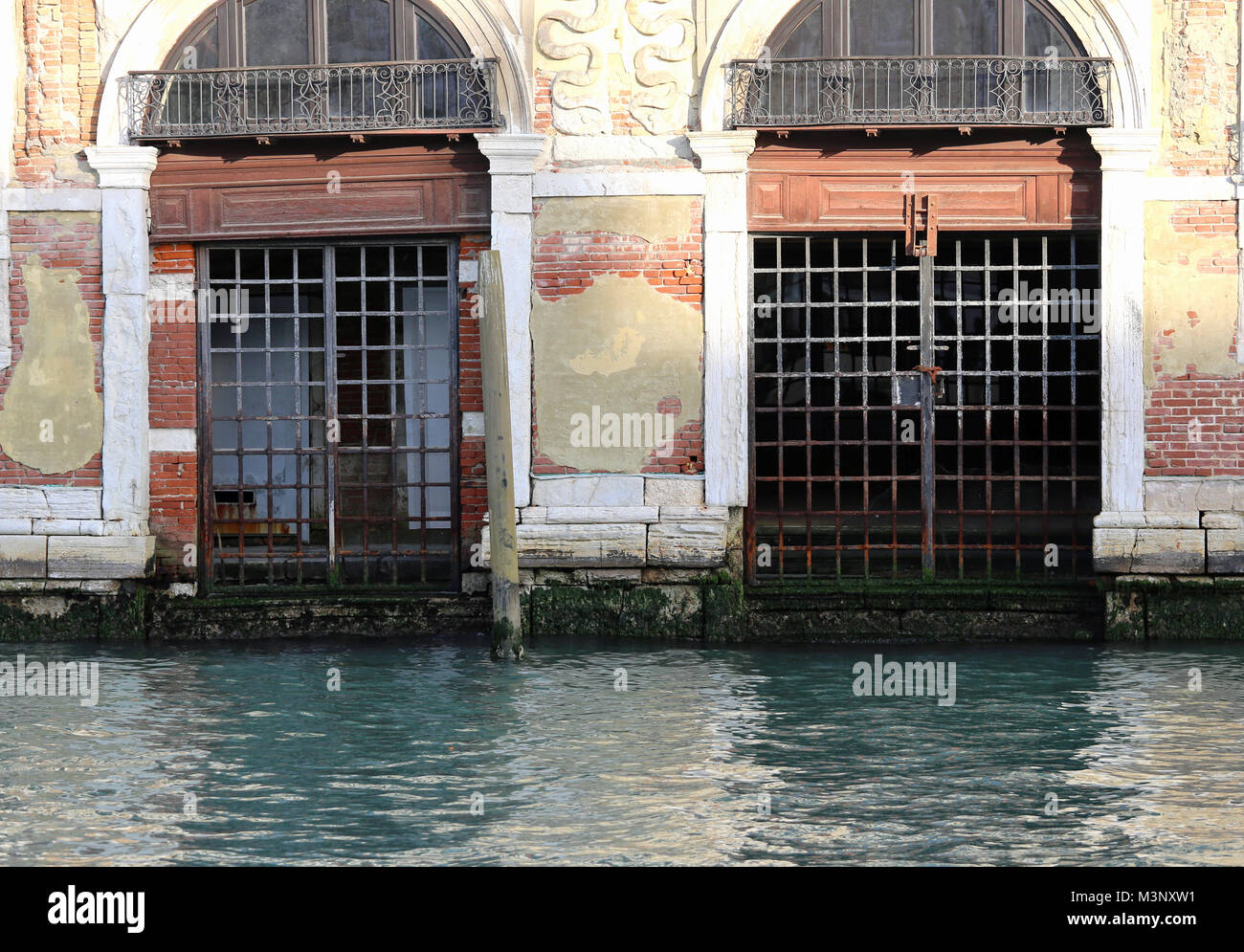 Two old rusty Gates in Venice during low tide Stock Photo - Alamy