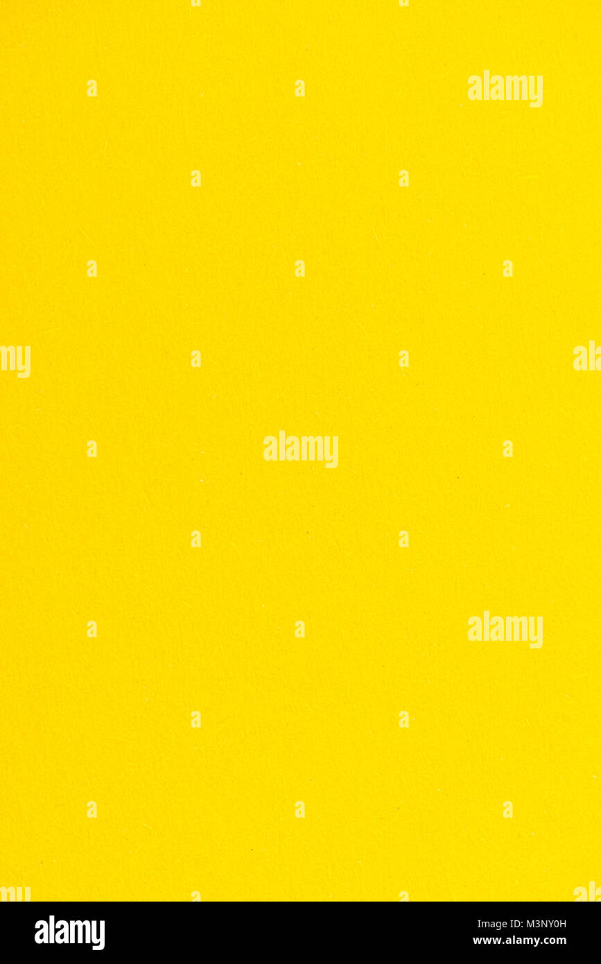 texture of yellow color paper as background Stock Photo - Alamy