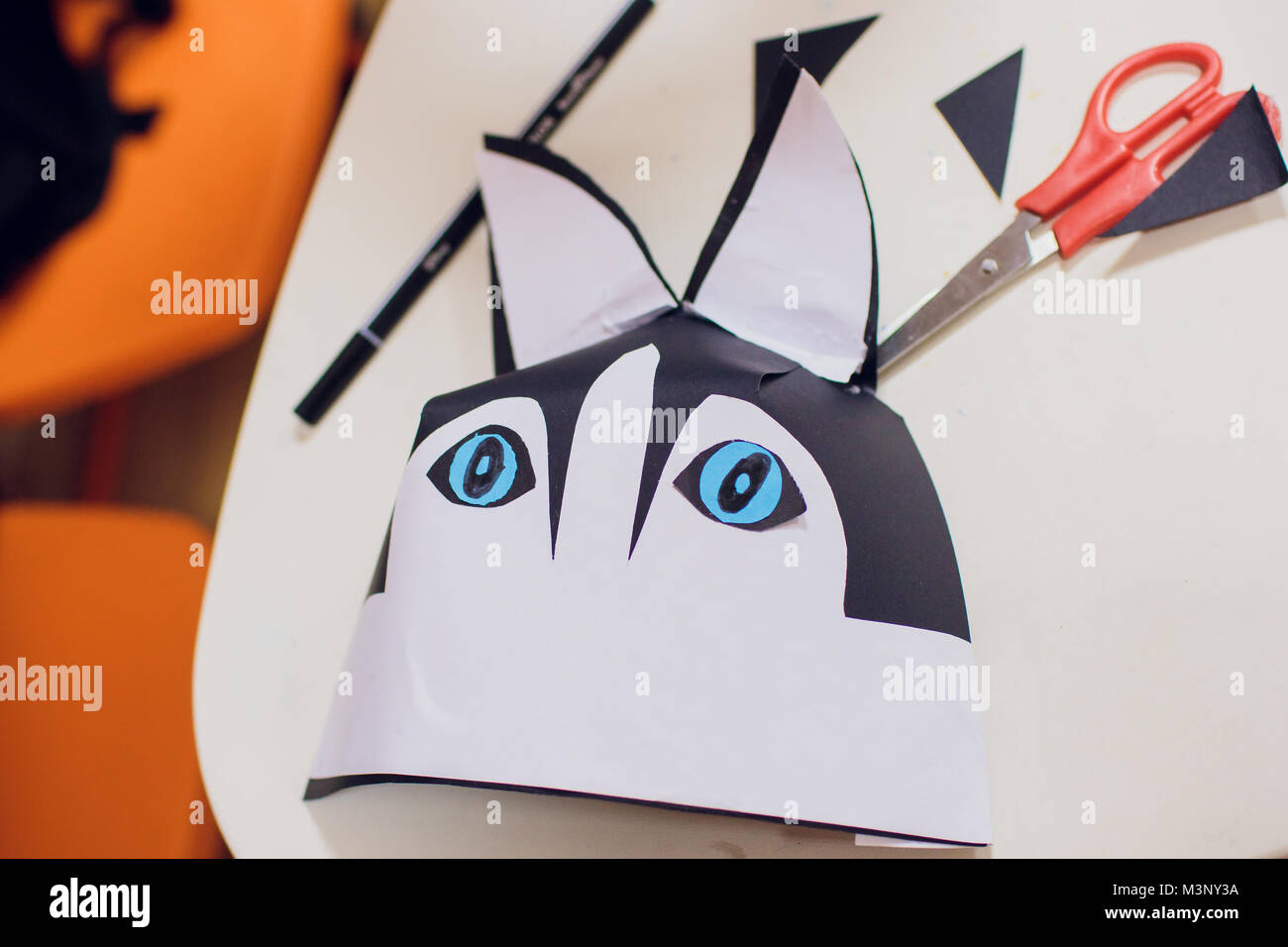 children make masks of husky dogs craft Stock Photo - Alamy