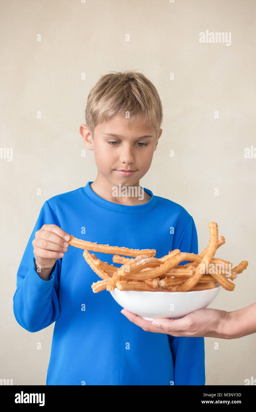 Child young boy eating bakery hi-res stock photography and images - Alamy