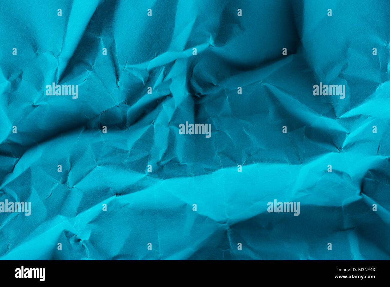 close-up shot of crumpled blue paper for background Stock Photo - Alamy