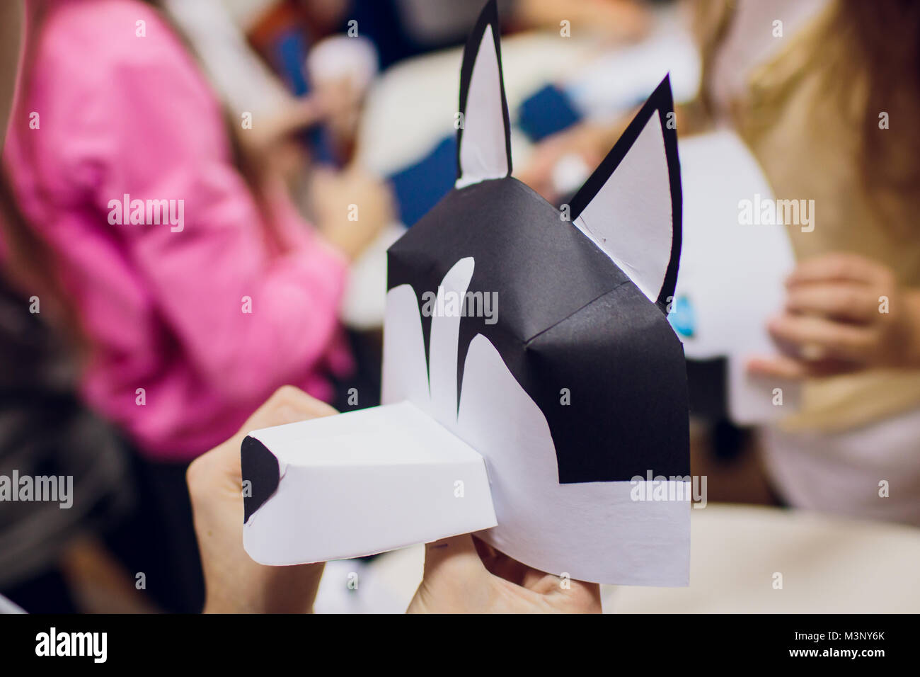 children make masks of husky dogs craft Stock Photo - Alamy