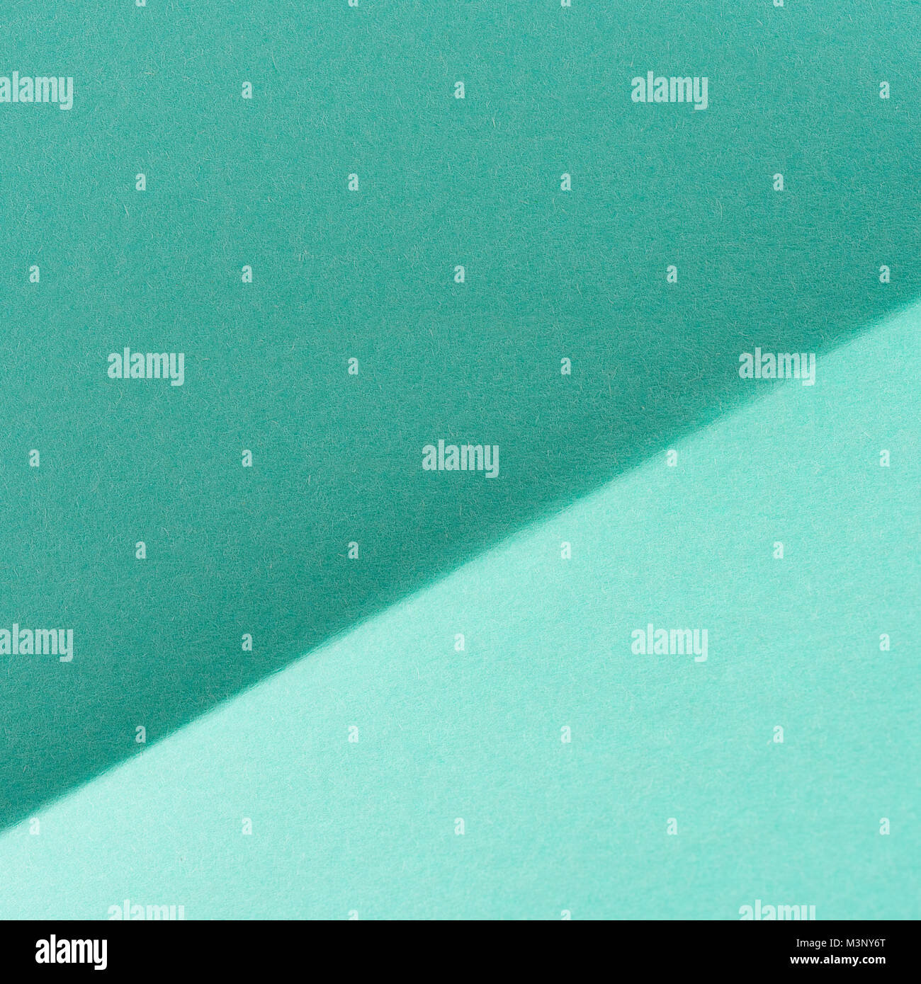 close-up shot of turquoise color folded paper for background Stock ...