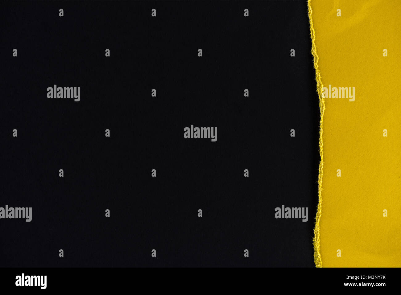 piece of yellow paper isolated on black Stock Photo - Alamy