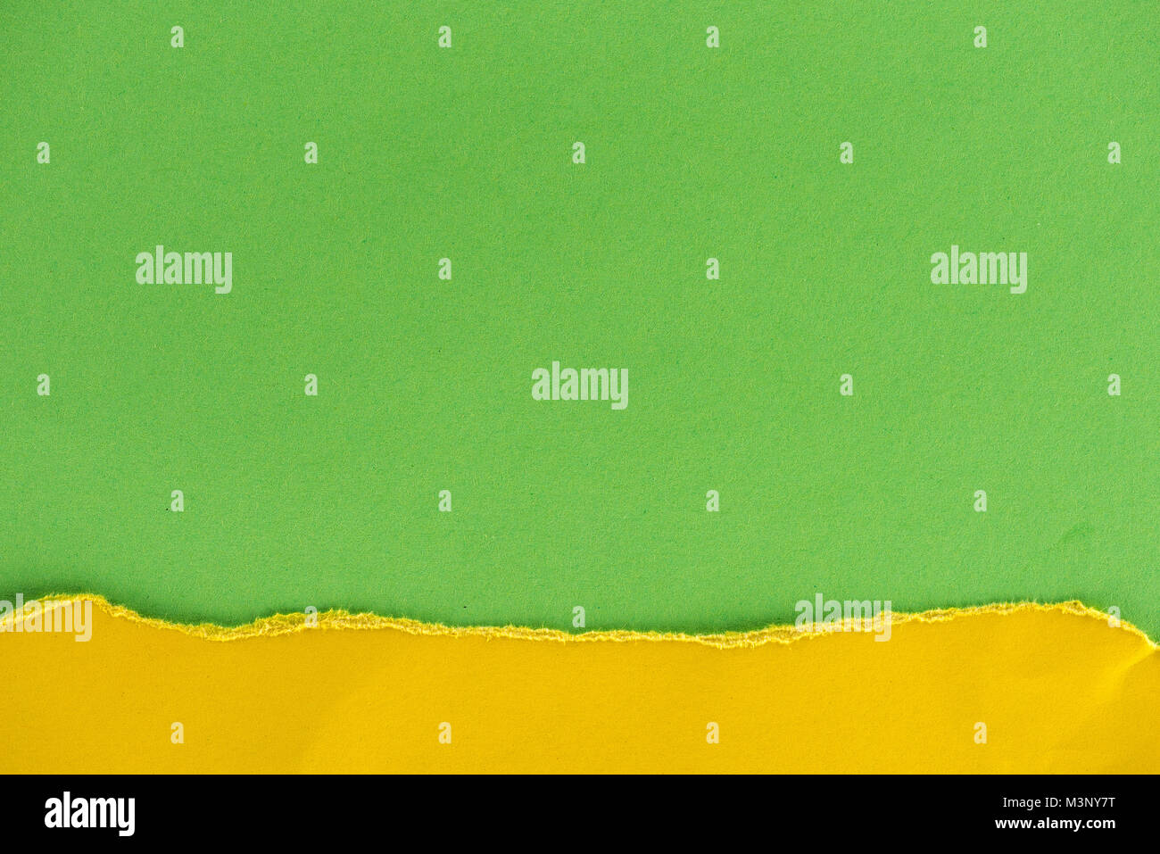 close-up shot of green and yellow paper layers for background Stock ...
