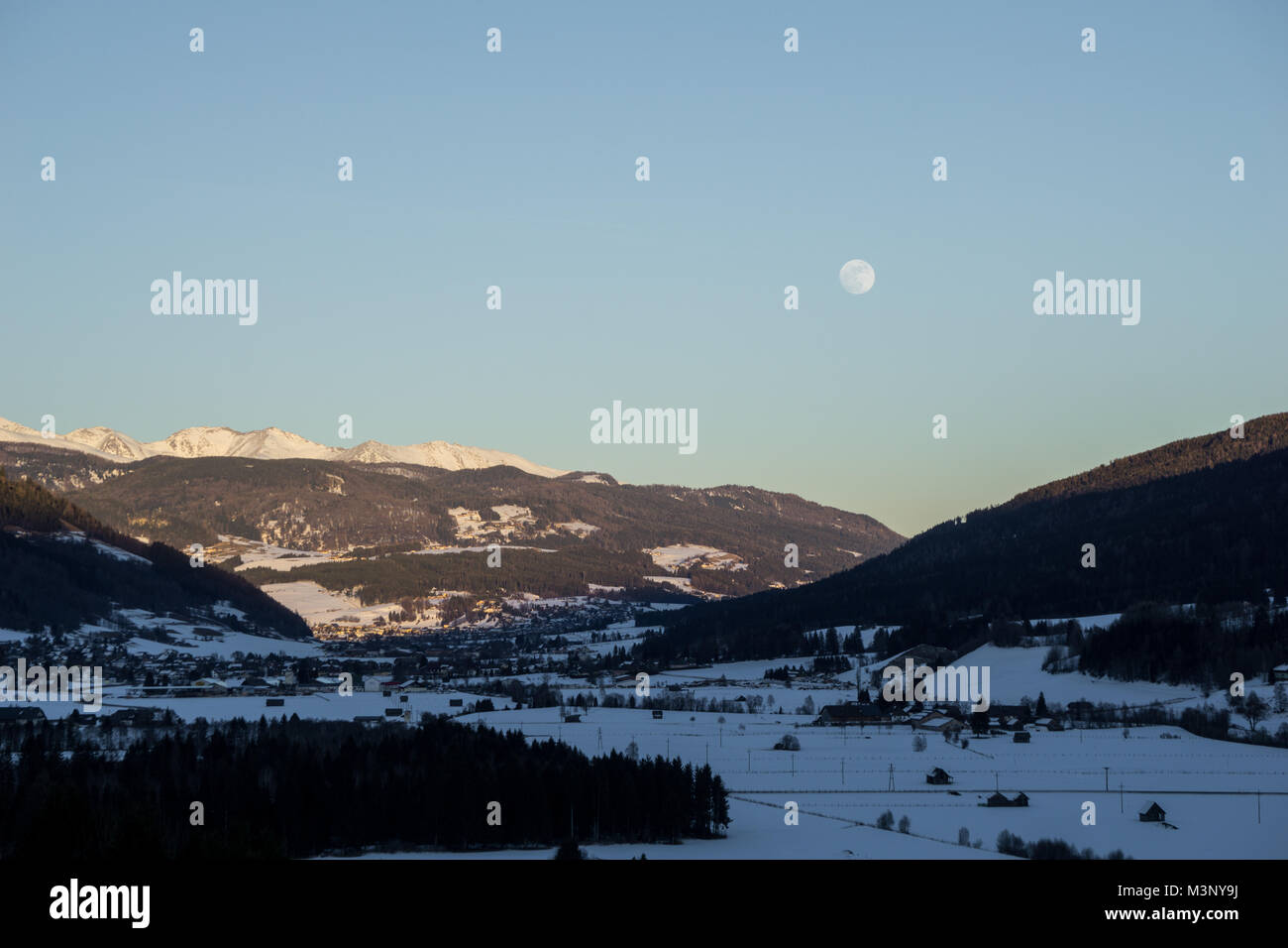 Super blue moon rising over a rural Austrian landscape just before ...
