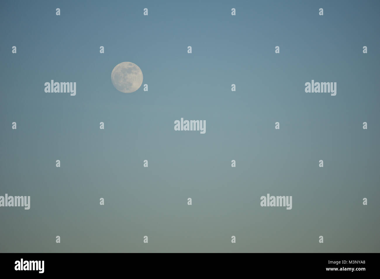 The moon in the upper left corner of the picture with ample copy space ...