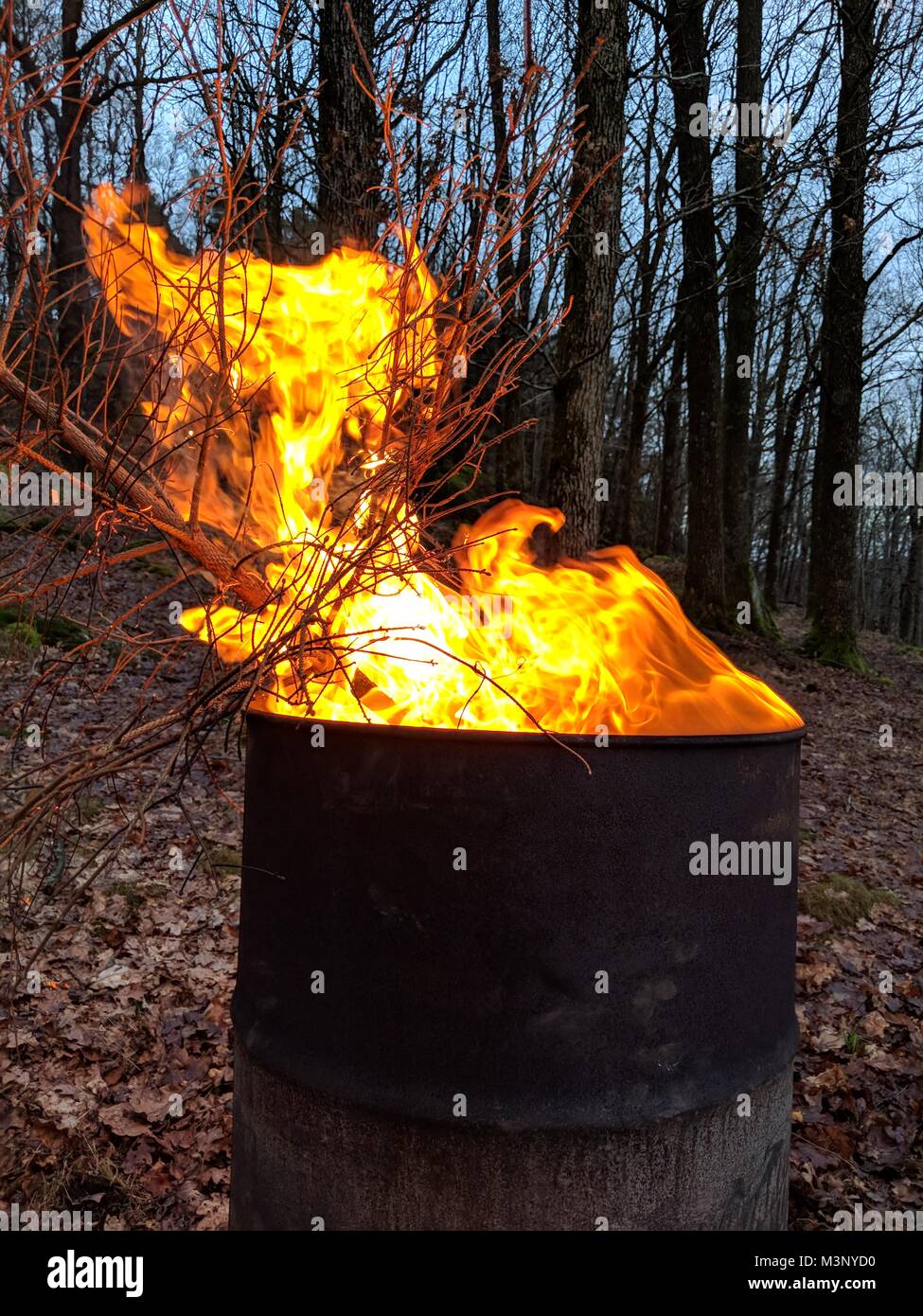 Flames in a barrel Stock Photo - Alamy