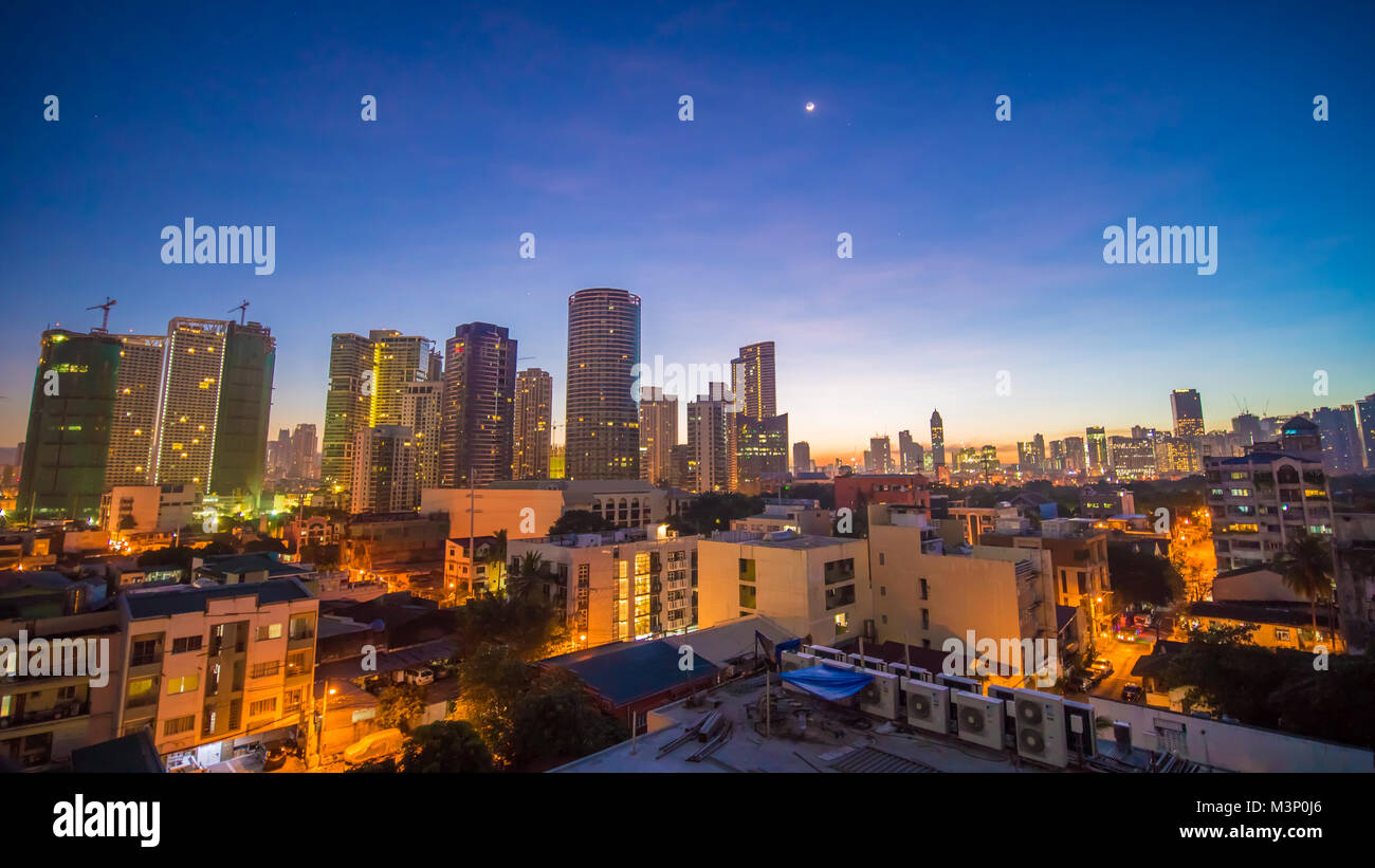 The capital of the Philippines is Manila. Makati city. Early dawn in ...