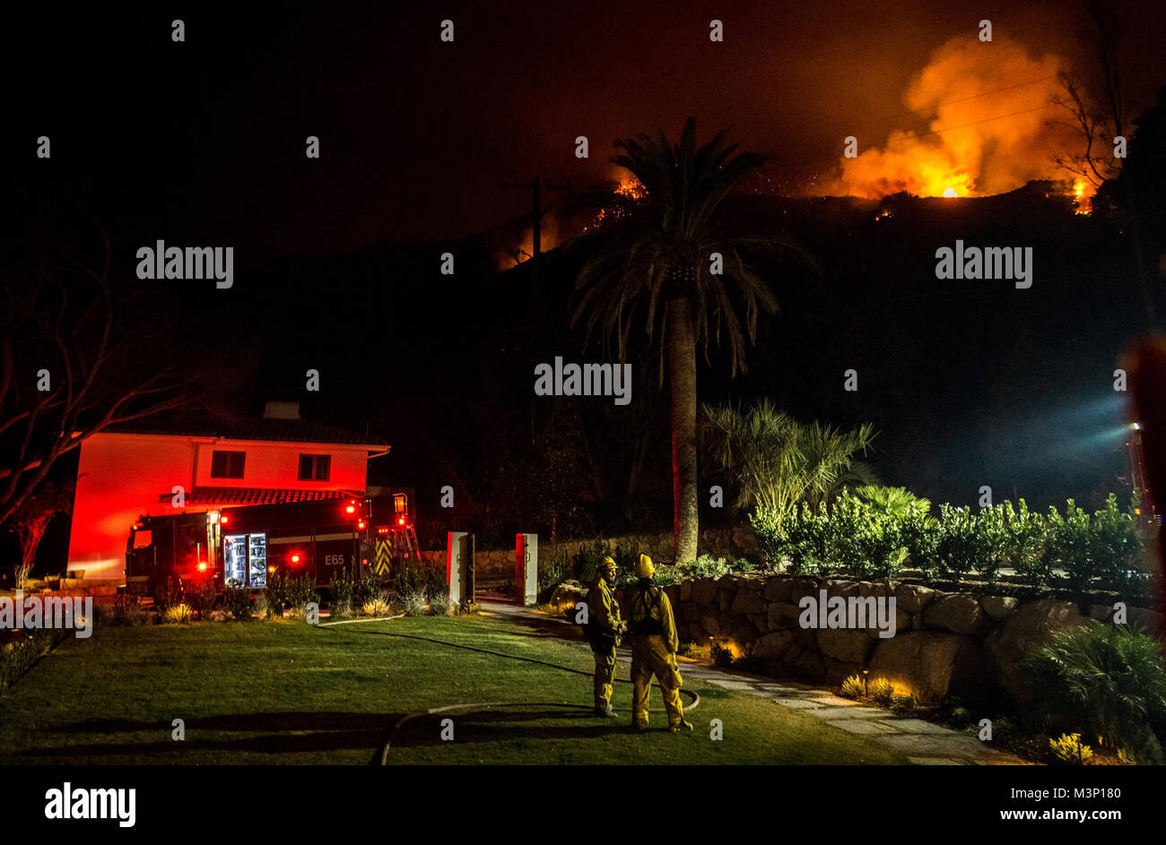 Chino Valley firefighters watch the oncoming flames of the Thomas Fire ...