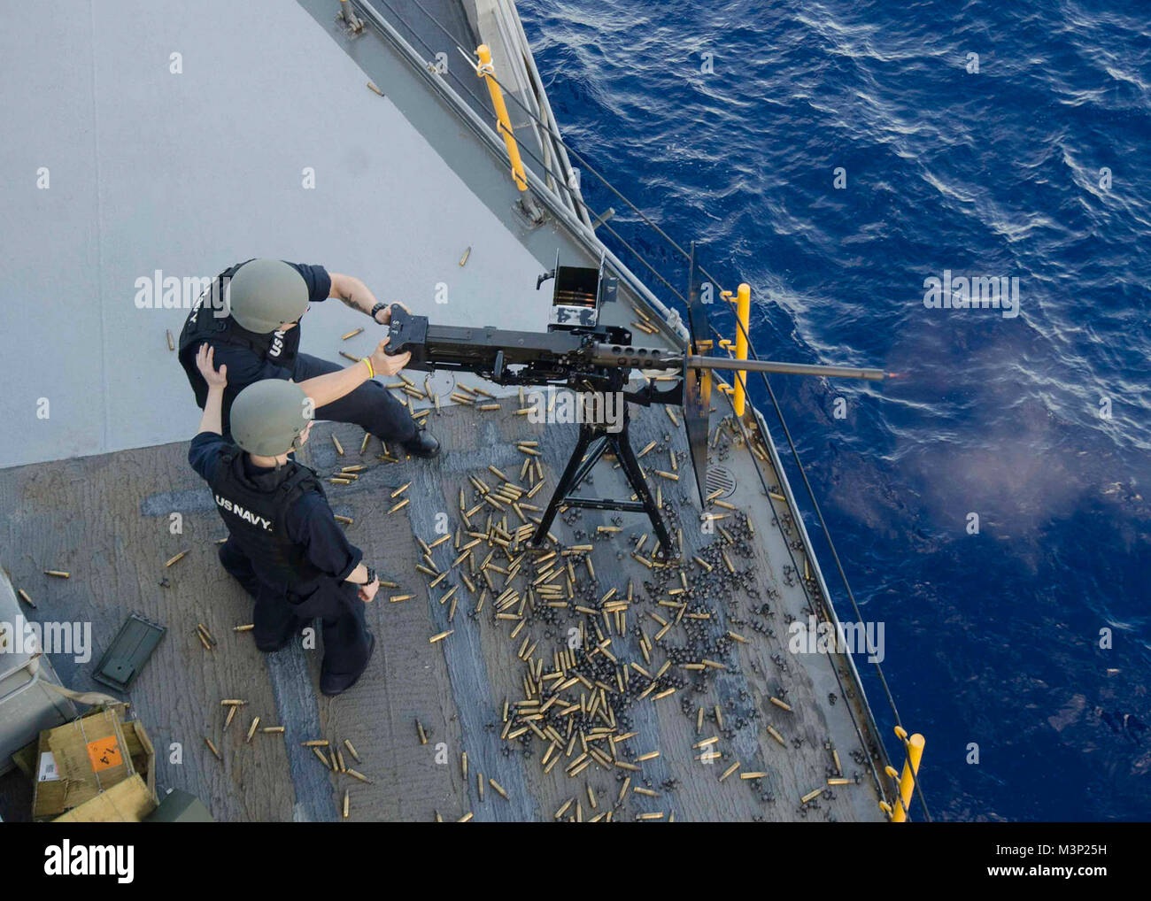 Sailors conduct weapons training aboard the submarine tender USS Frank ...