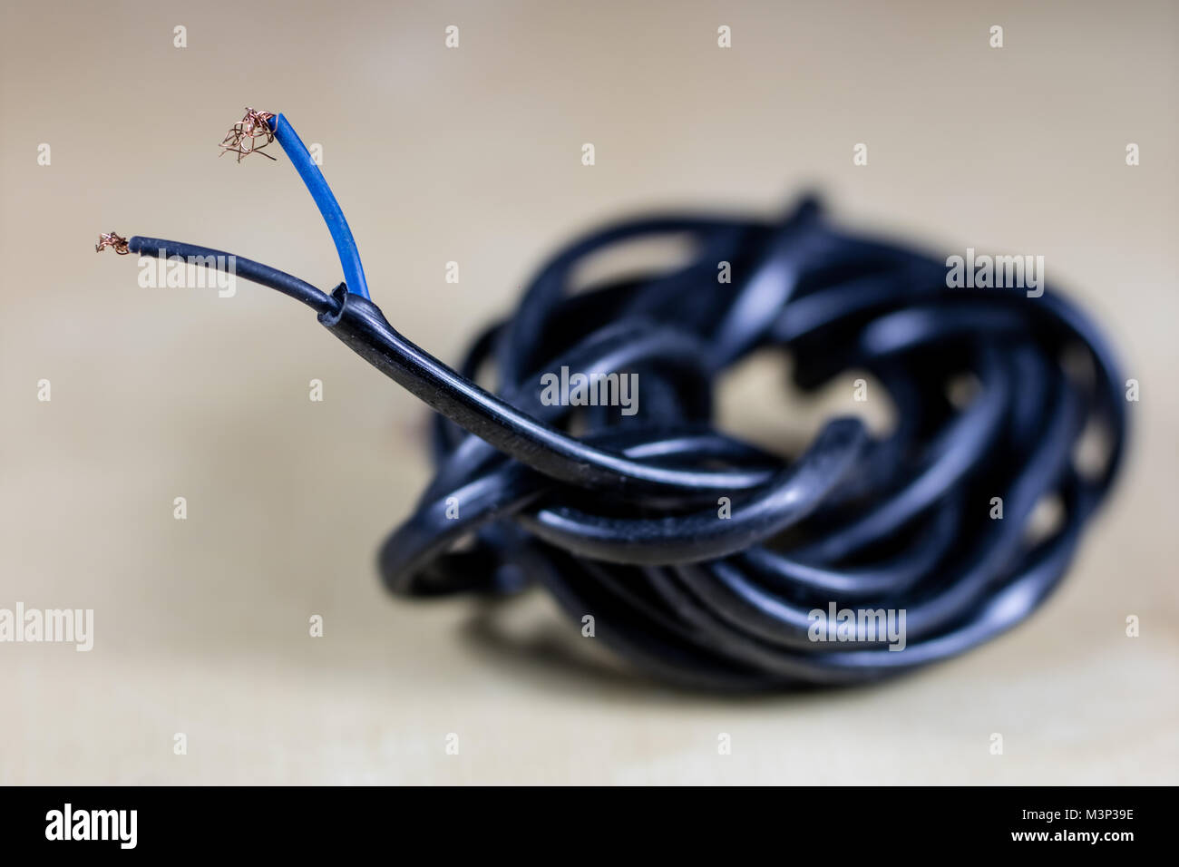 Electric cables, plugs and connectors on a wooden workshop table ...