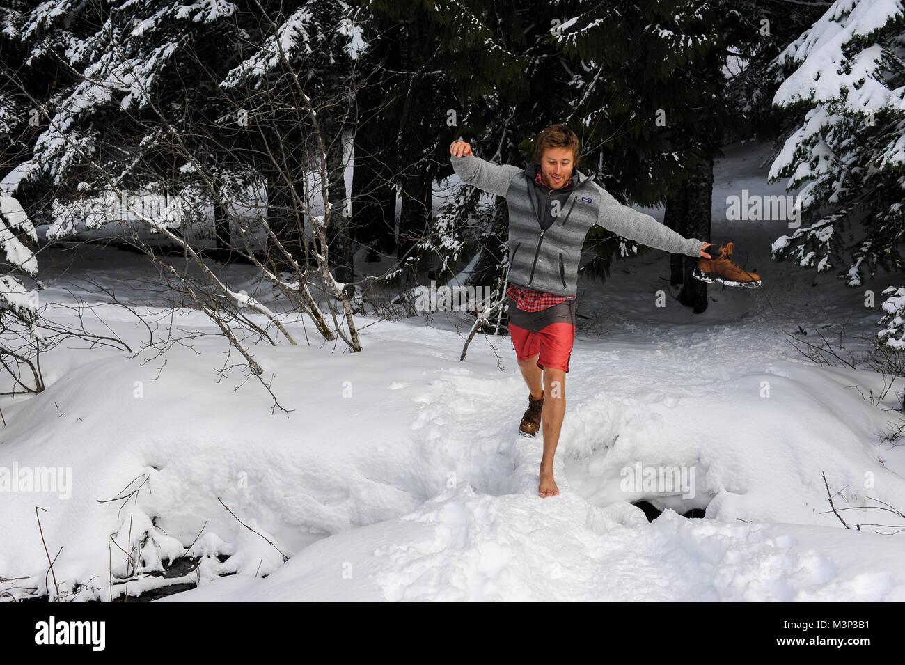 Barefoot in the snow hi-res stock photography and images - Alamy