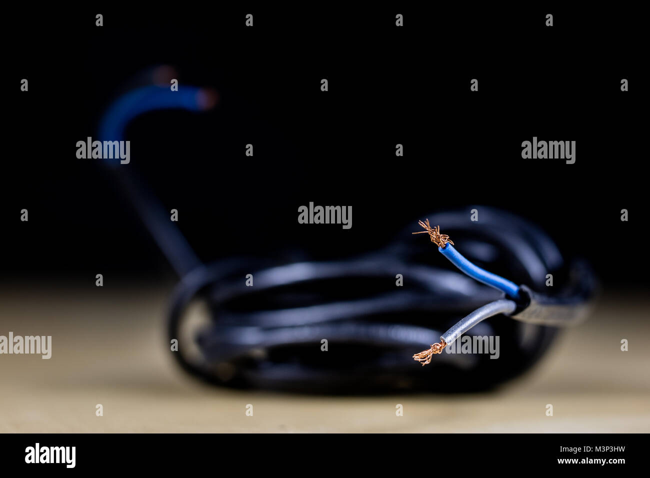 Electric cables, plugs and connectors on a wooden workshop table ...