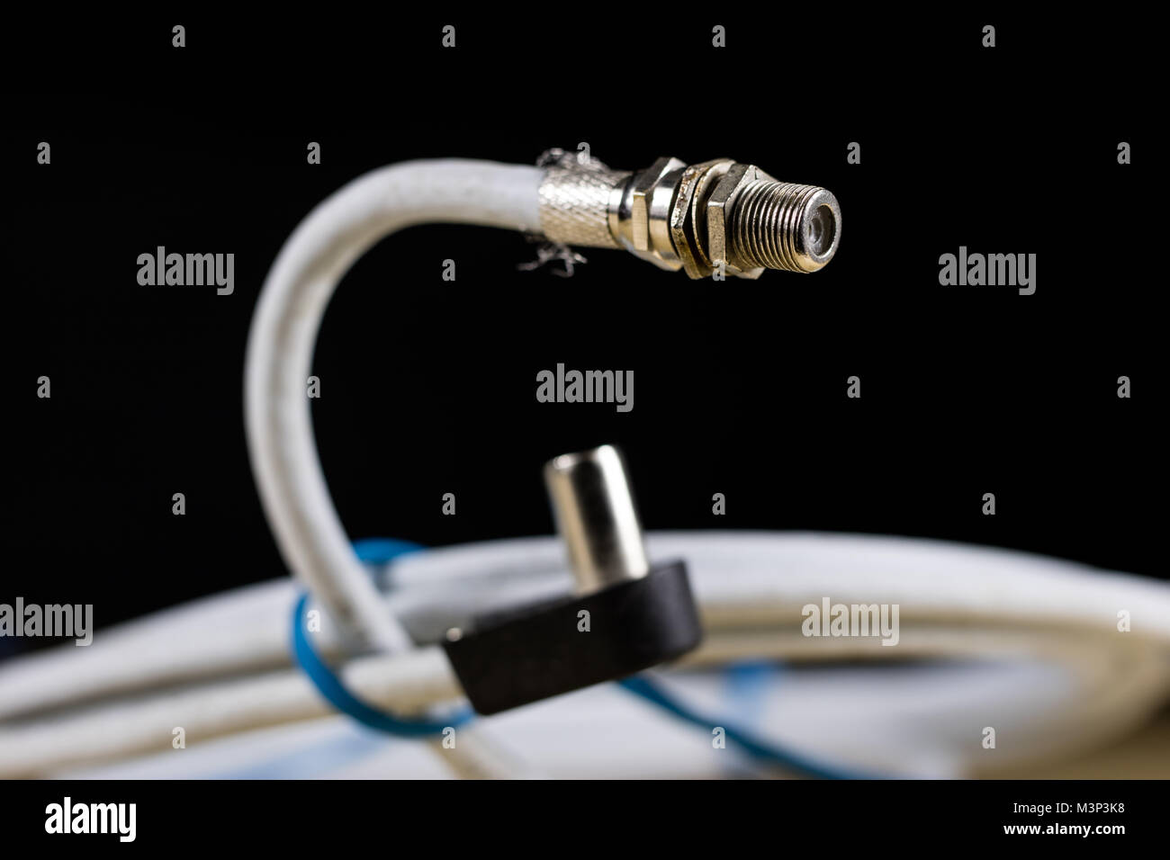 Electric cables, plugs and connectors on a wooden workshop table ...