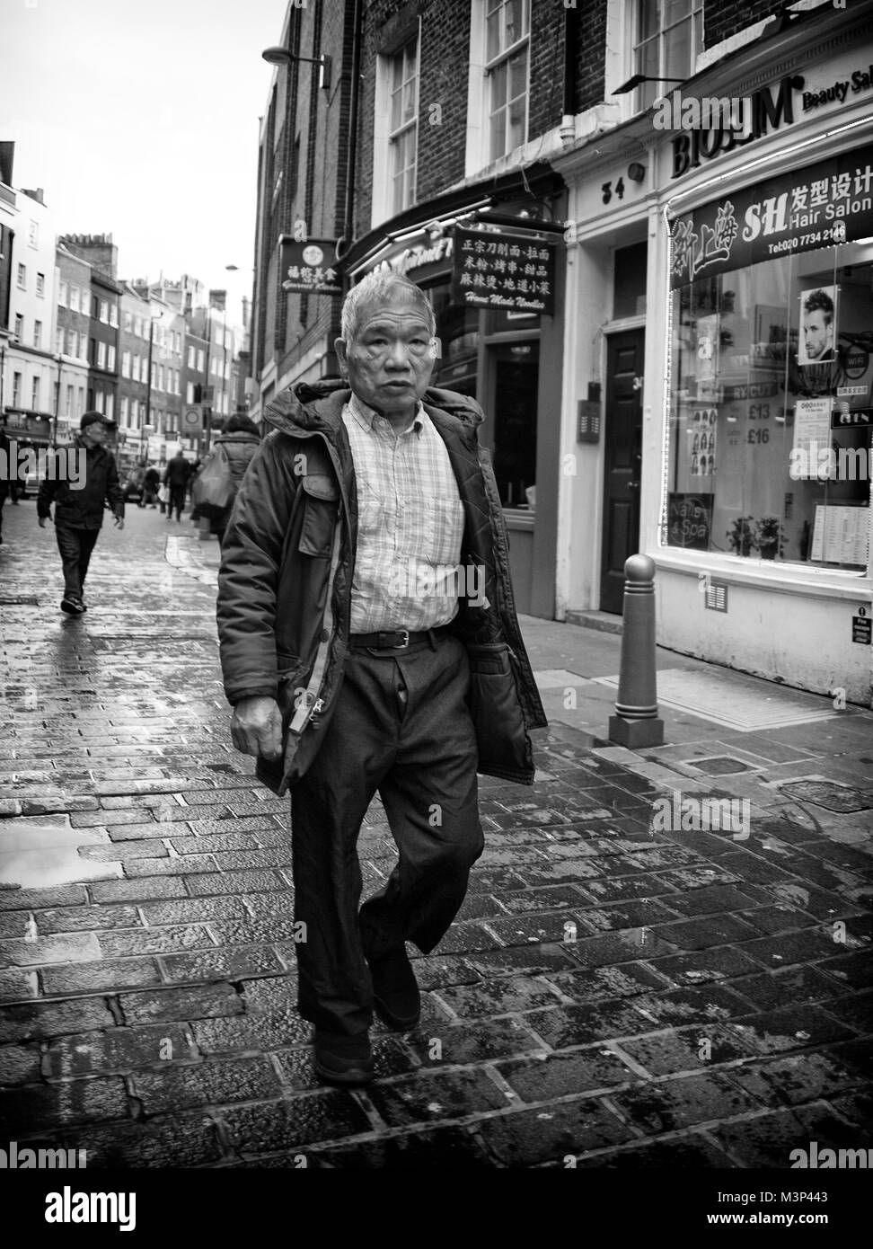 Chinese man walking in China Town, Soho, Central London, England, UK ...