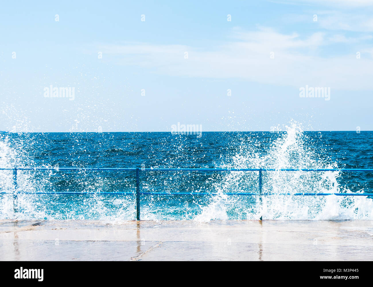Huge stormy sea waves splash on cement pier Stock Photo - Alamy
