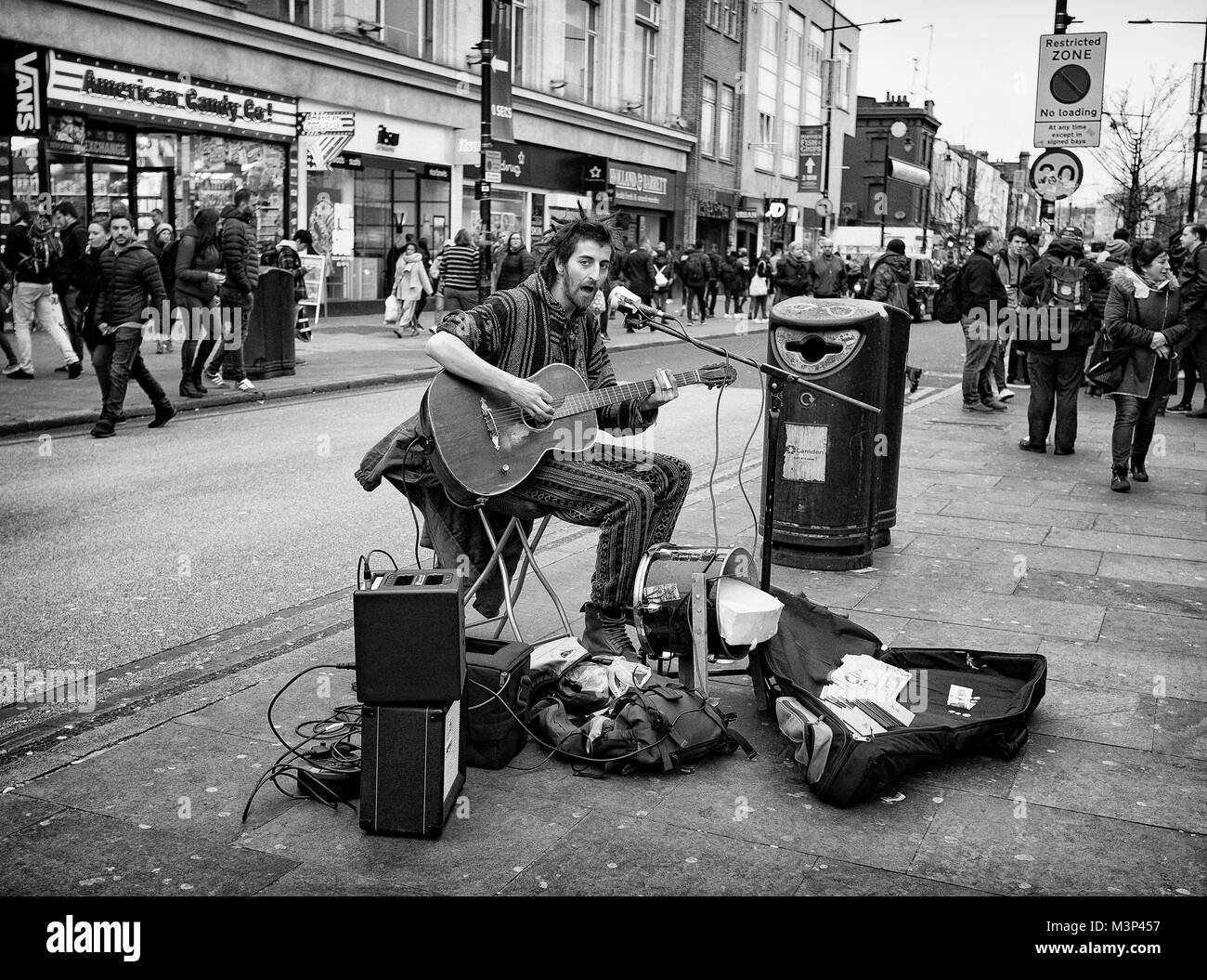 Black & White Photograph of a busker playing his guitar, Camden Town ...