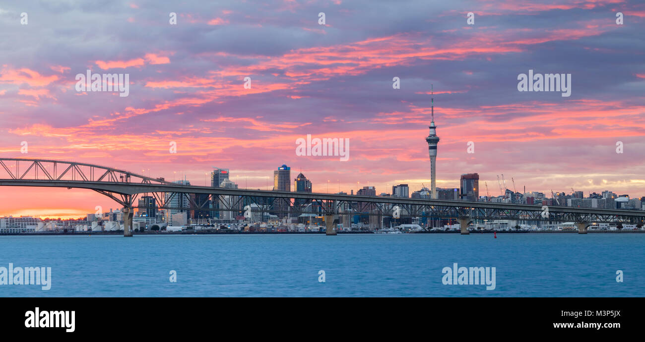 Bridge over the City of Auckland with a wonderful clouded morning sky ...
