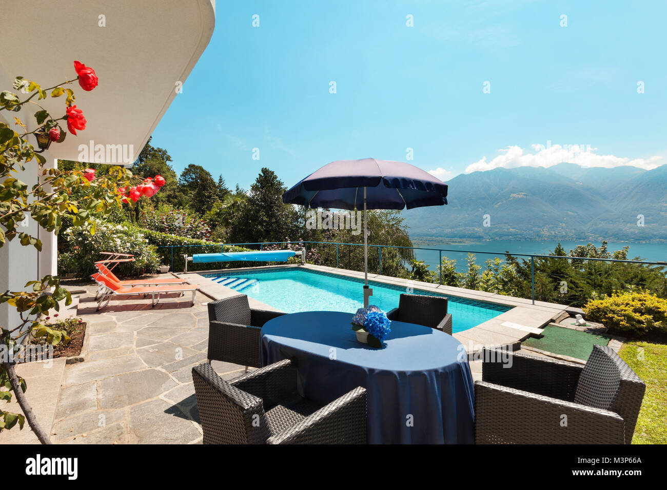 Nice terrace with swimming pool in a house on the lake Stock Photo - Alamy