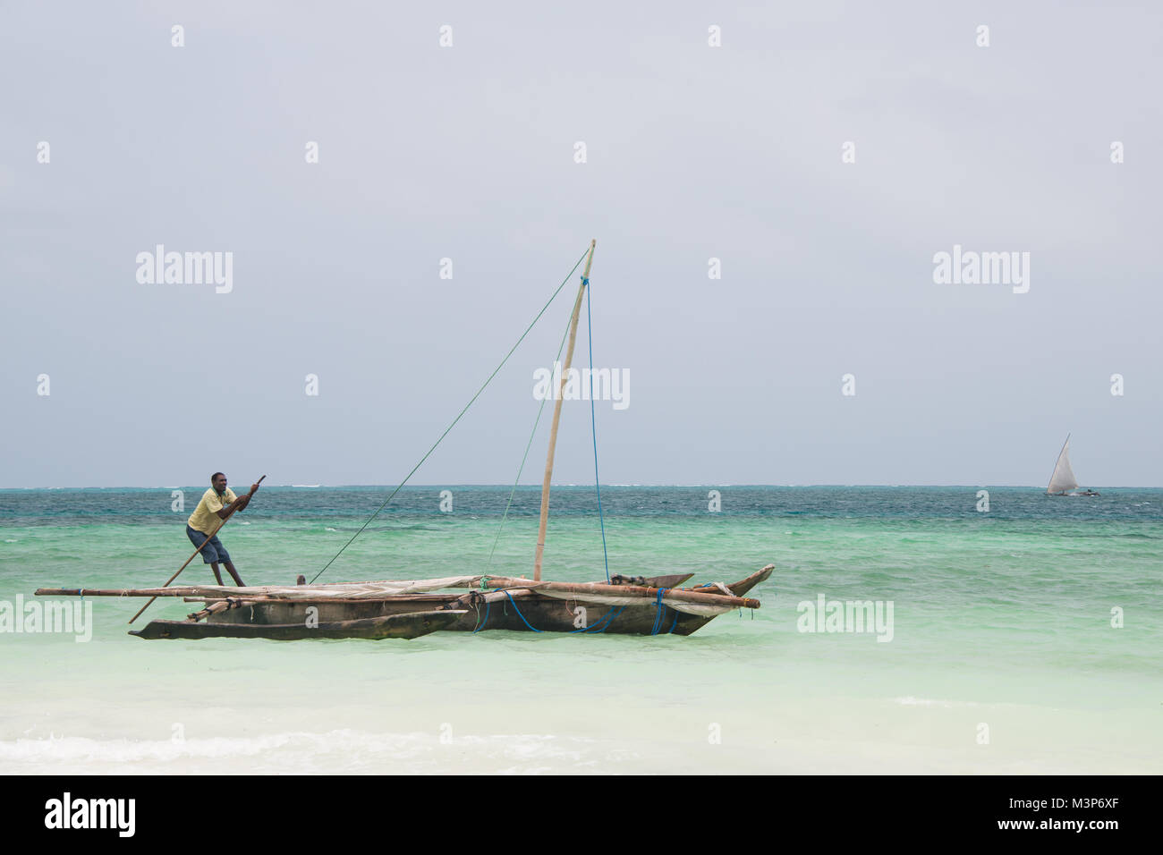 KIWENGWA, ZANZIBAR - DEC 29, 2017: local man pushing his traditional ...