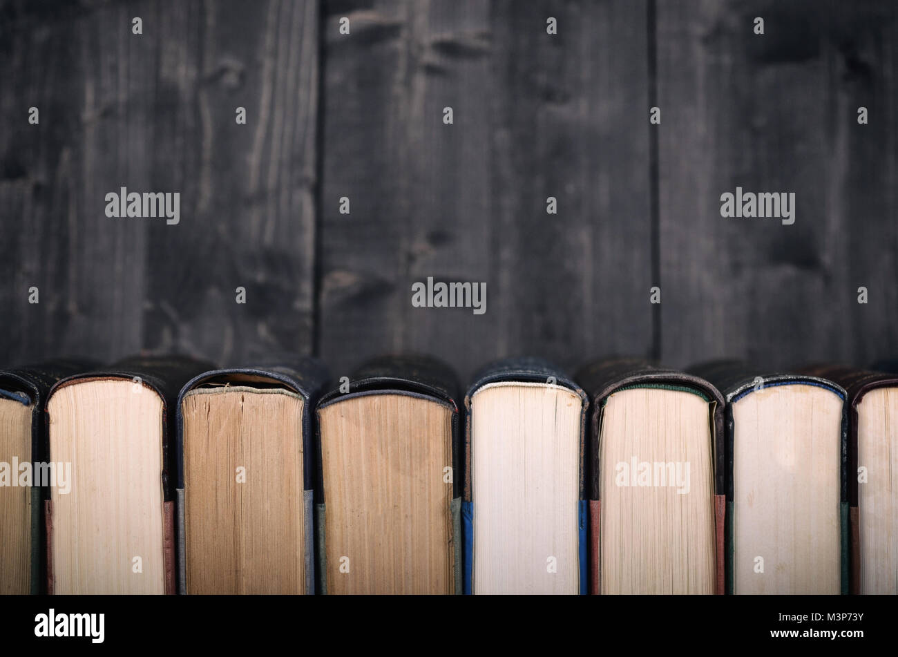 Old Law books on the black wooden background, black wooden backdrop ...