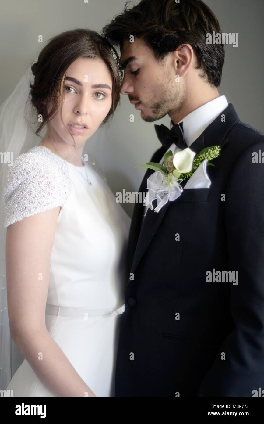 Beautiful dark haired Bride and Groom on a styled Wedding day ...