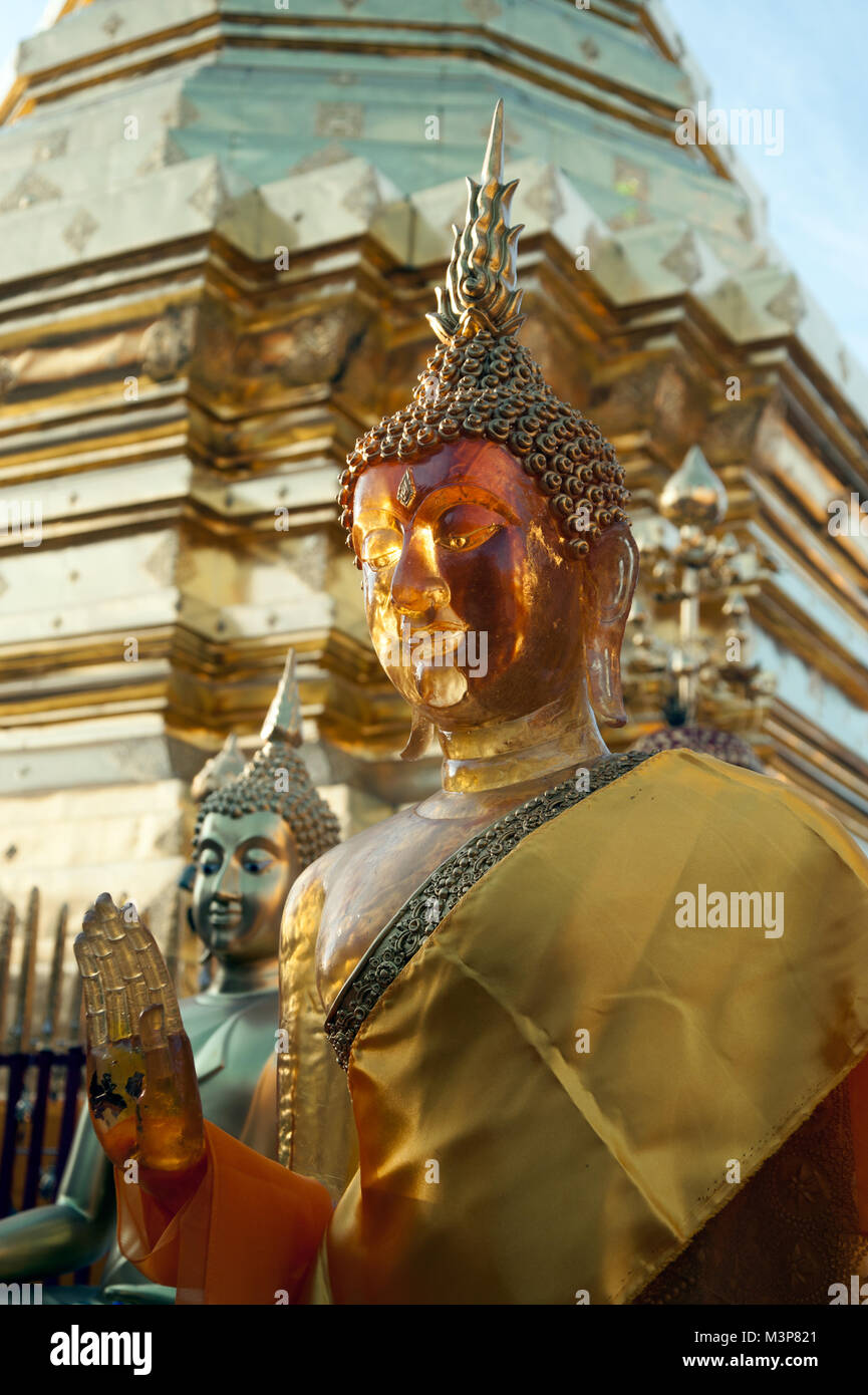Face of standing outdoor Buddha at golden Pagoda of Wat Phra That Doi ...