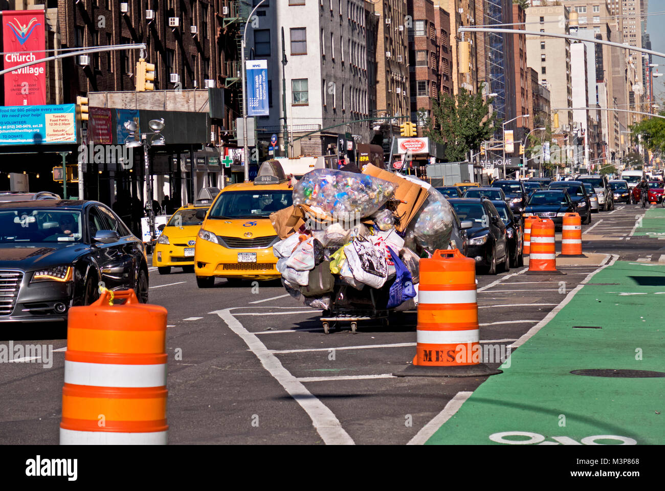 Homeless person's shopping trolley carts piled with all their ...