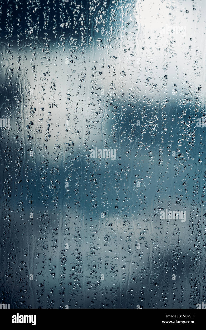 water drops of rain on a window glass. Rainy day Stock Photo - Alamy