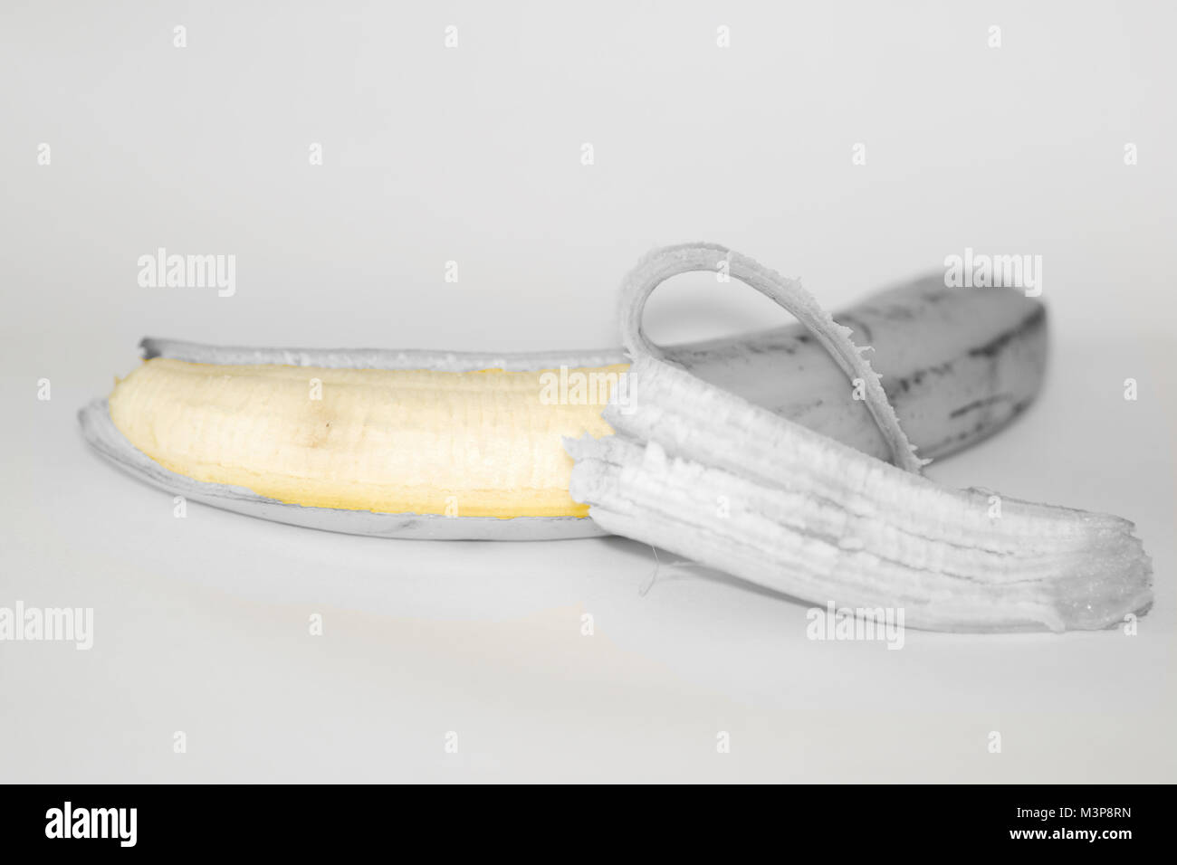 Photo montage of a banana with black and white shell Stock Photo - Alamy